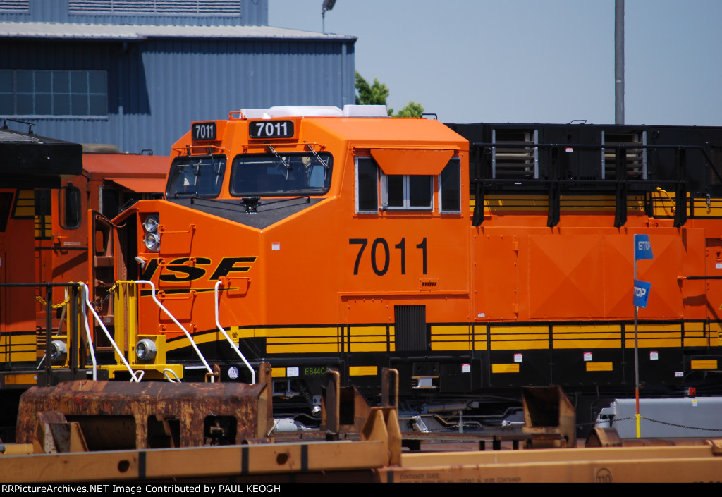 BNSF 7011 Gleems in the Afternoon Sun as she sits on the BNSF City of Commerce Fueling Pits ...